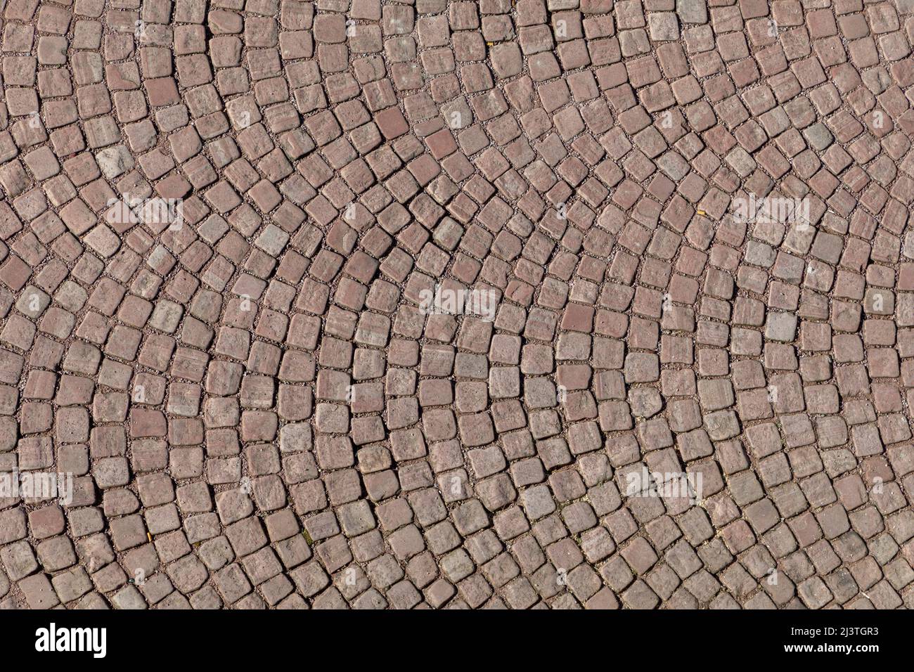 background of basalt cobble stone in red at the historic street Stock ...