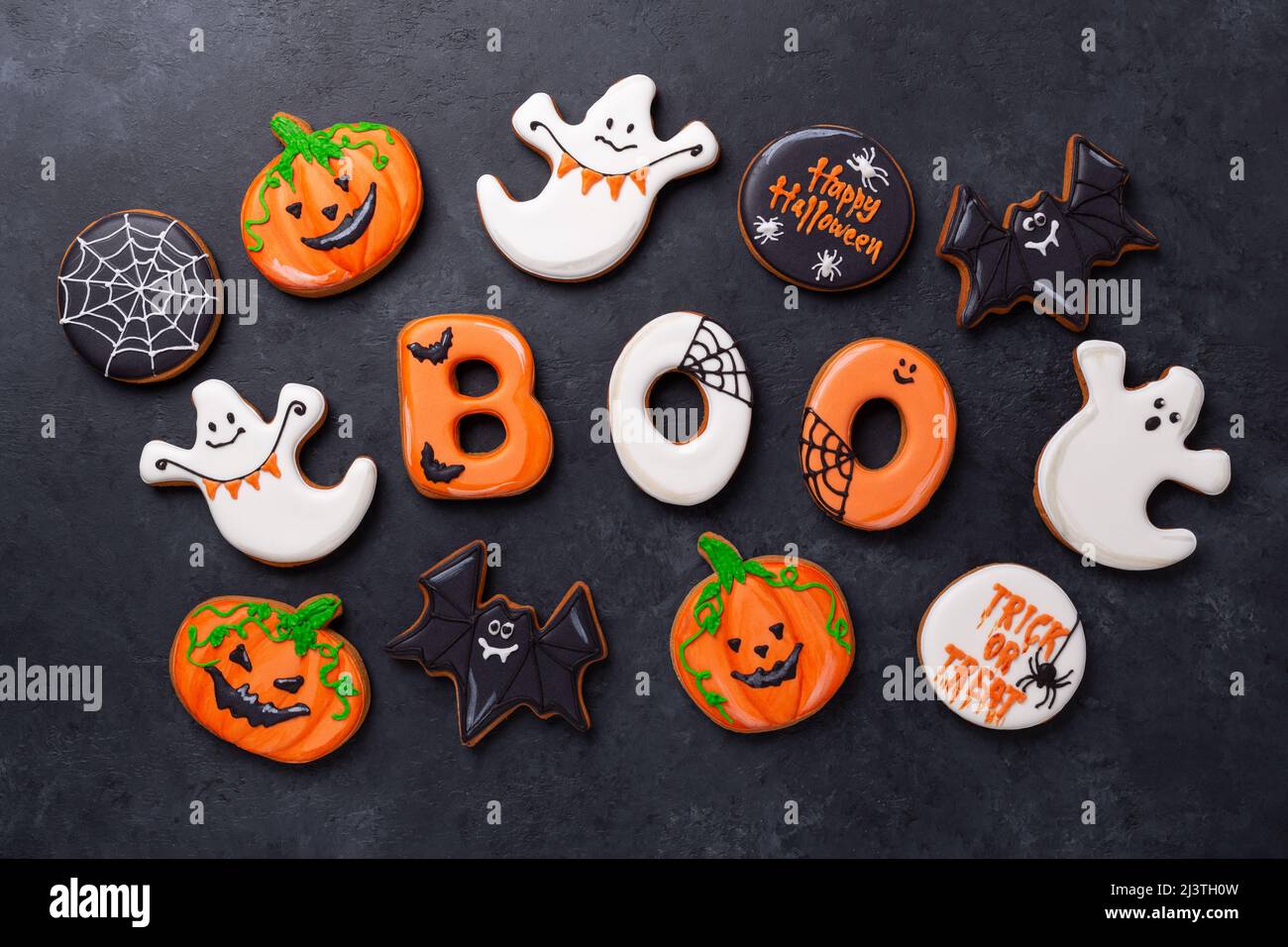 Halloween gingerbread cookies on dark stone background. Bright homemade ...