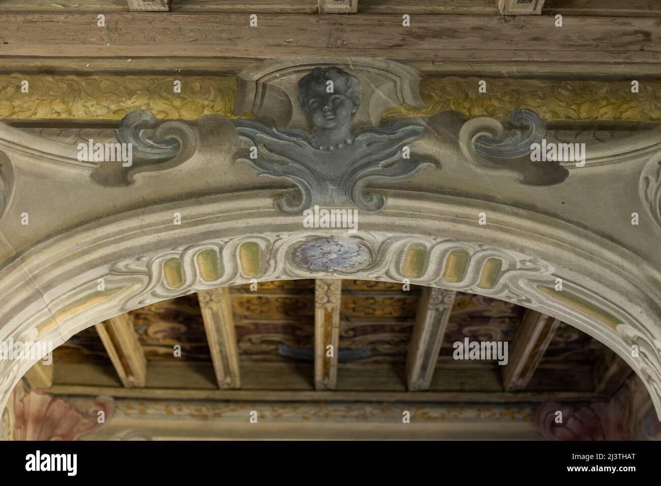 a beautiful old plaster decor on the walls of the ceiling in a classic ...