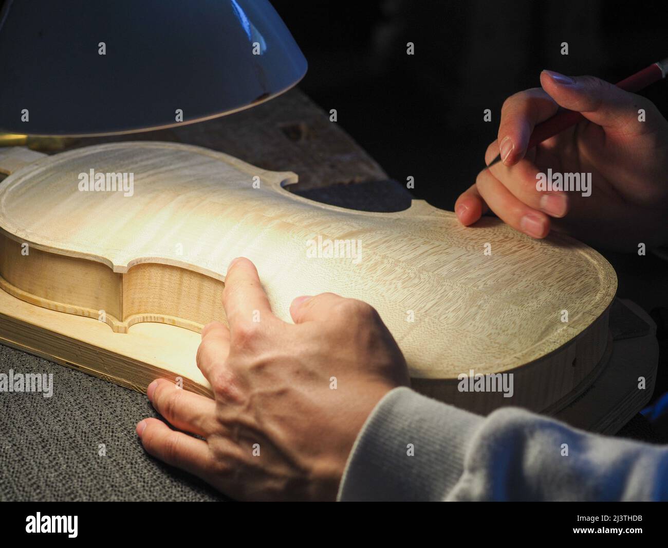 luthier working on a new violin in his workshop Stock Photo - Alamy