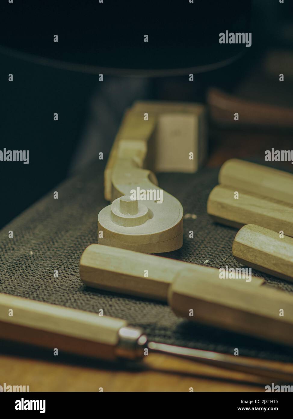 artisan sculpting a violin scroll - luthier at work concept Stock Photo ...