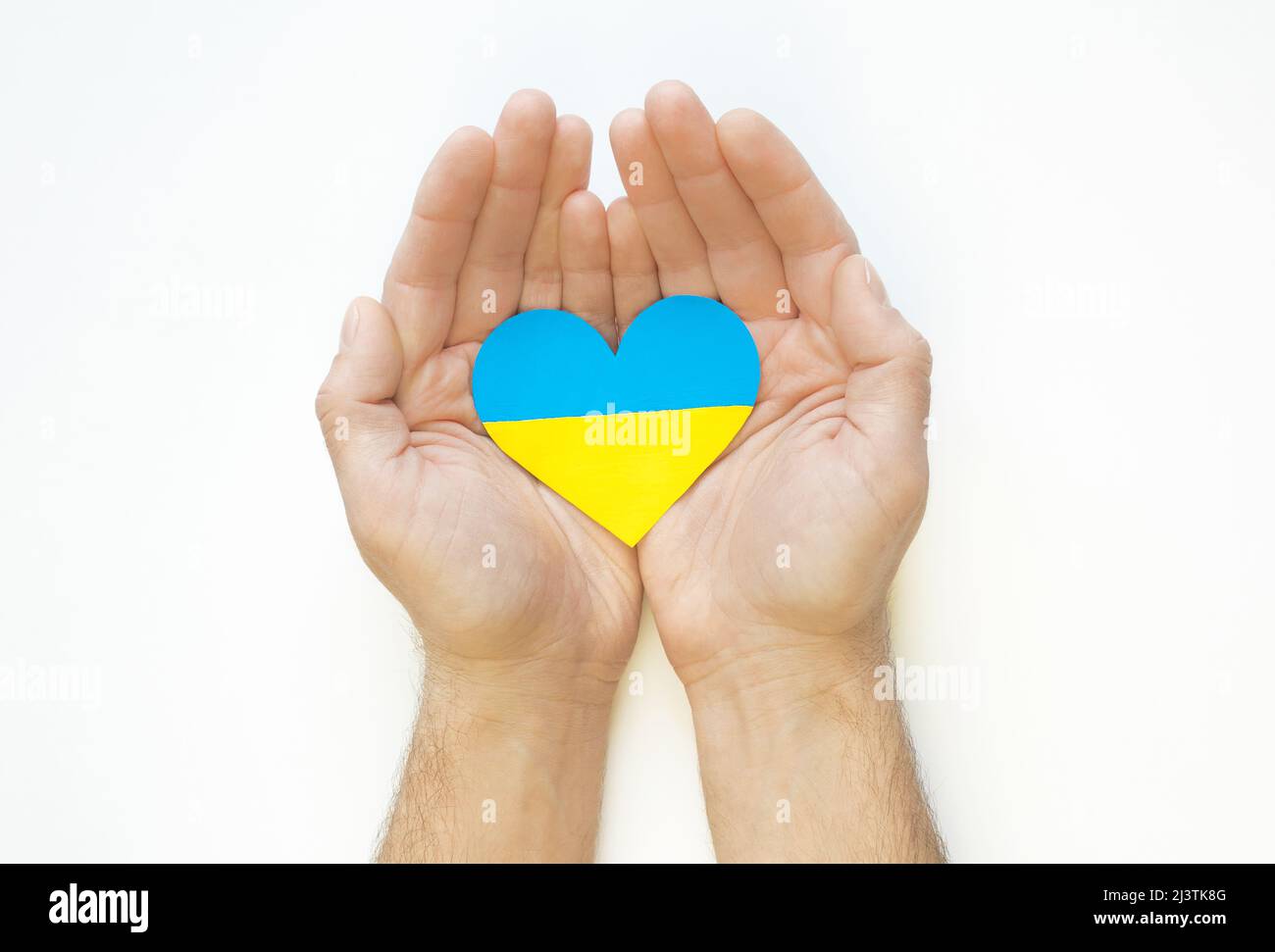 The concept of love for Ukraine. Heart in the colors of the flag of ...