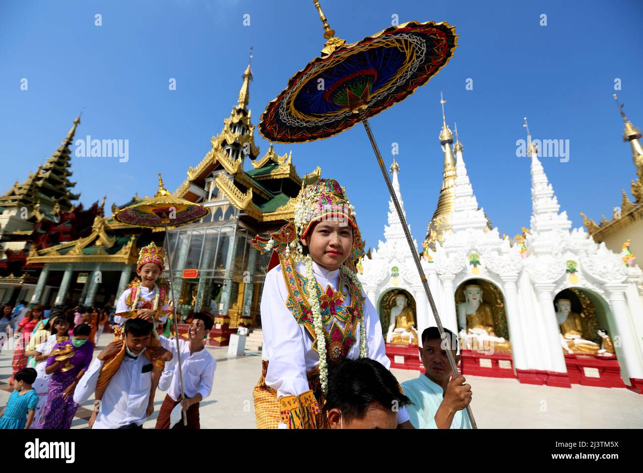 Yangon, Myanmar. 10th Apr, 2022. Boys in traditional attire attend the ...