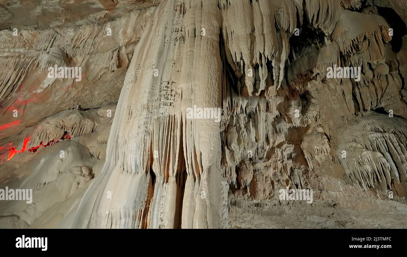 Inside lighted cave. Action. Amazing nature of stone caves inside ...