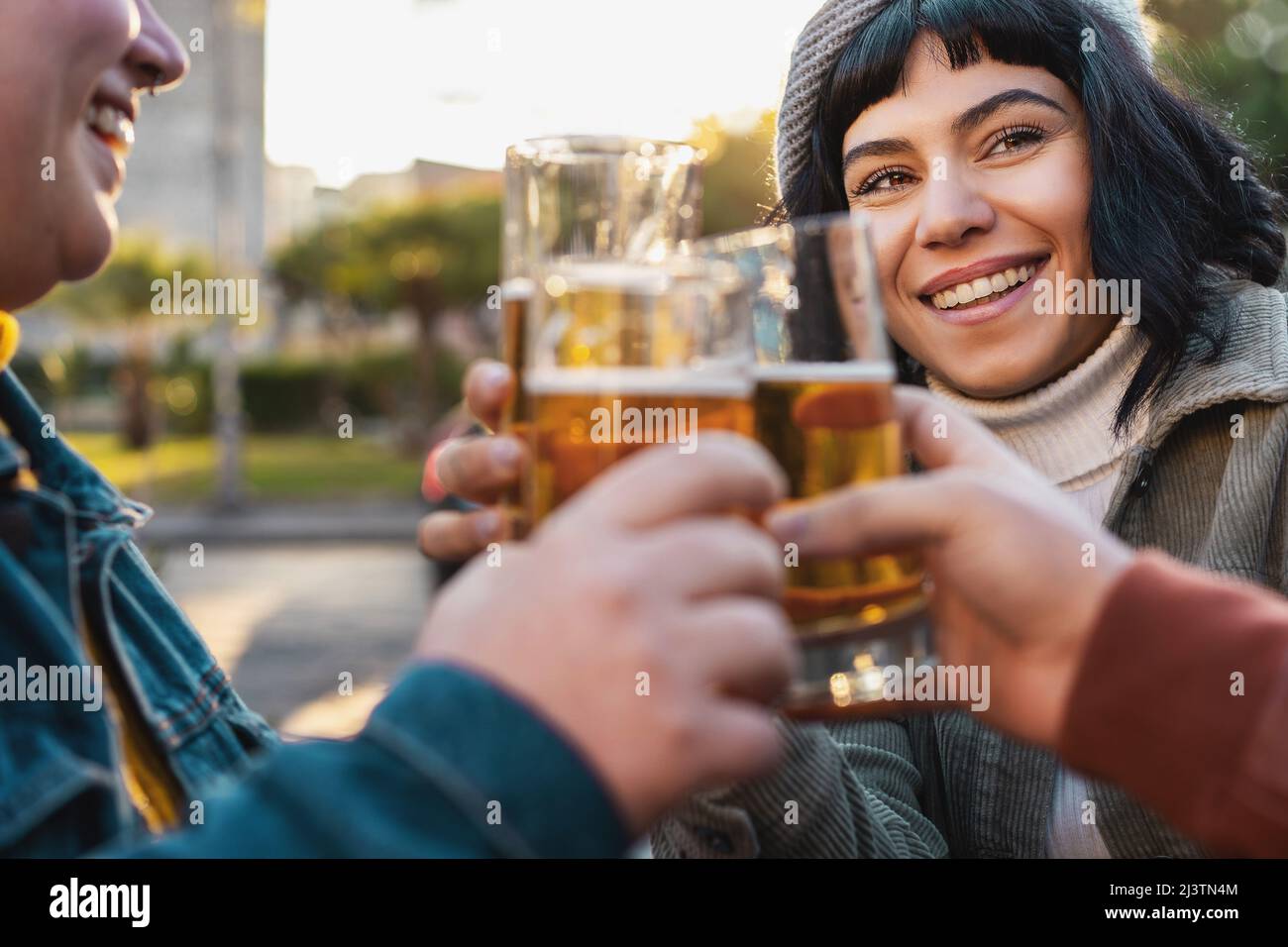 Group of happy friends drinking and toast beer at outdoors brewery ...