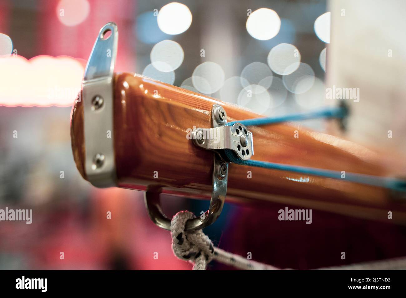 closeup perspective view of the boom mast of a vintage wooden sailing ...