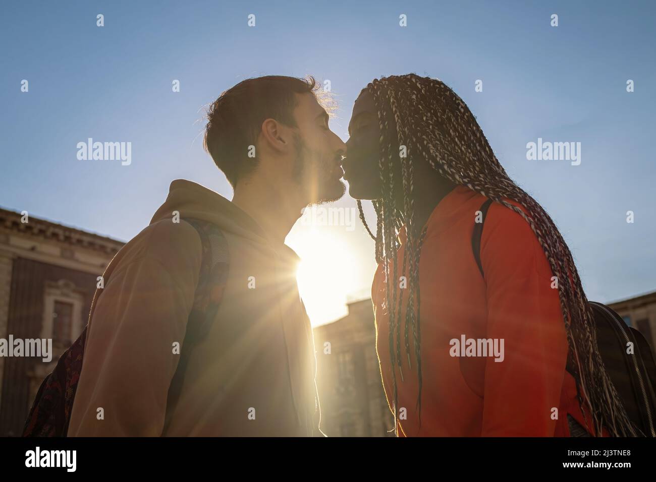 Kissing couple biracial hi-res stock photography and images - Alamy