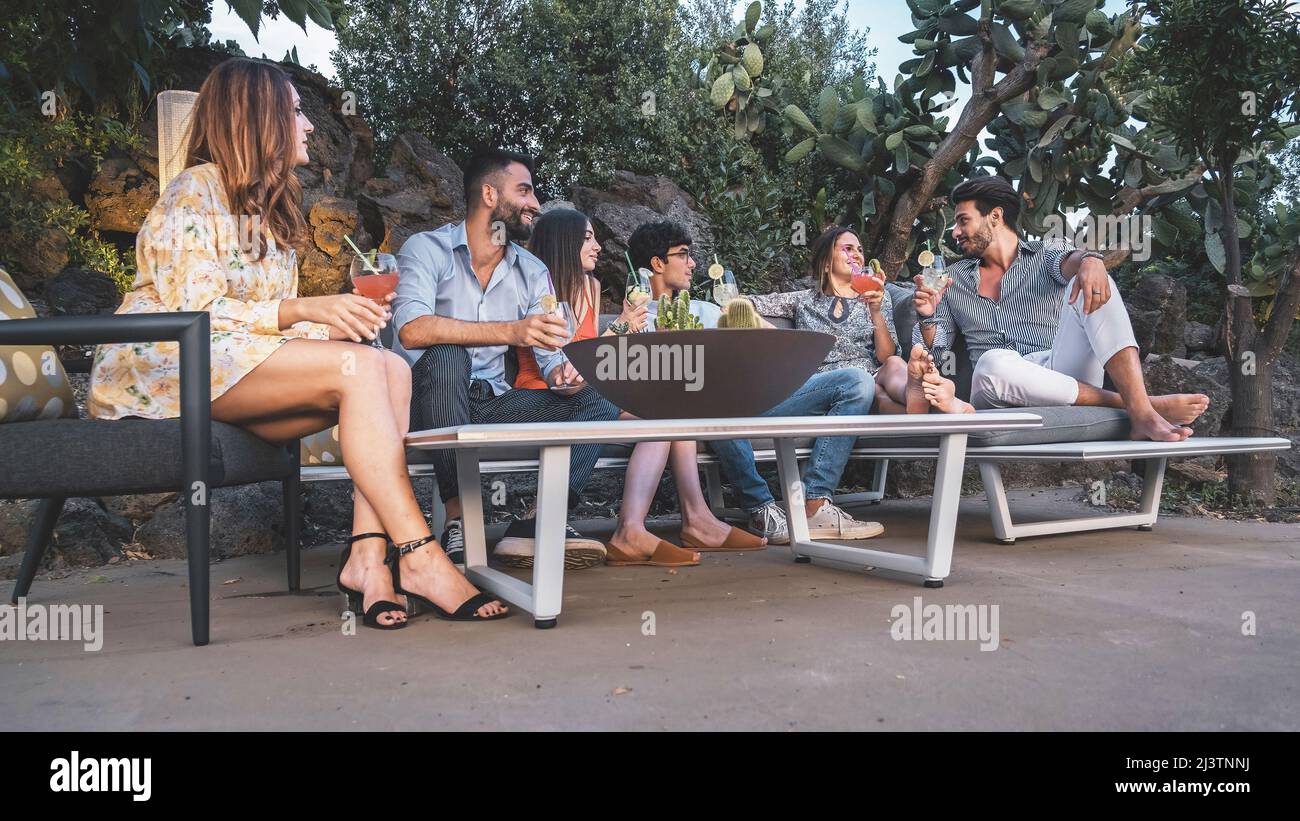 Best friend gathering in a terrace having fun together talking and ...