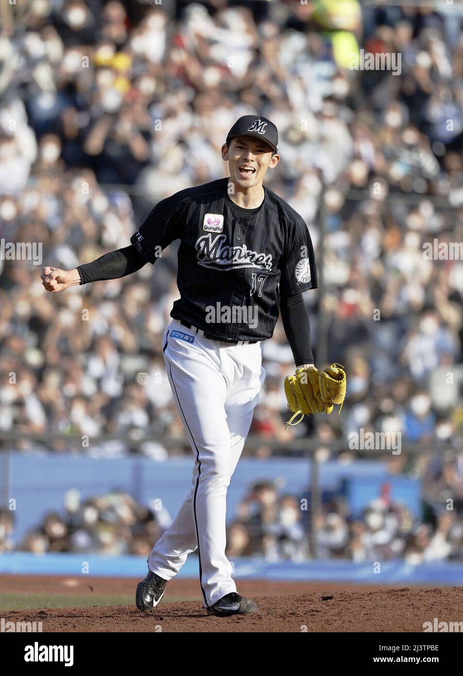 Lotte Marines pitcher Roki Sasaki reacts after throwing a perfect game against the Orix ...