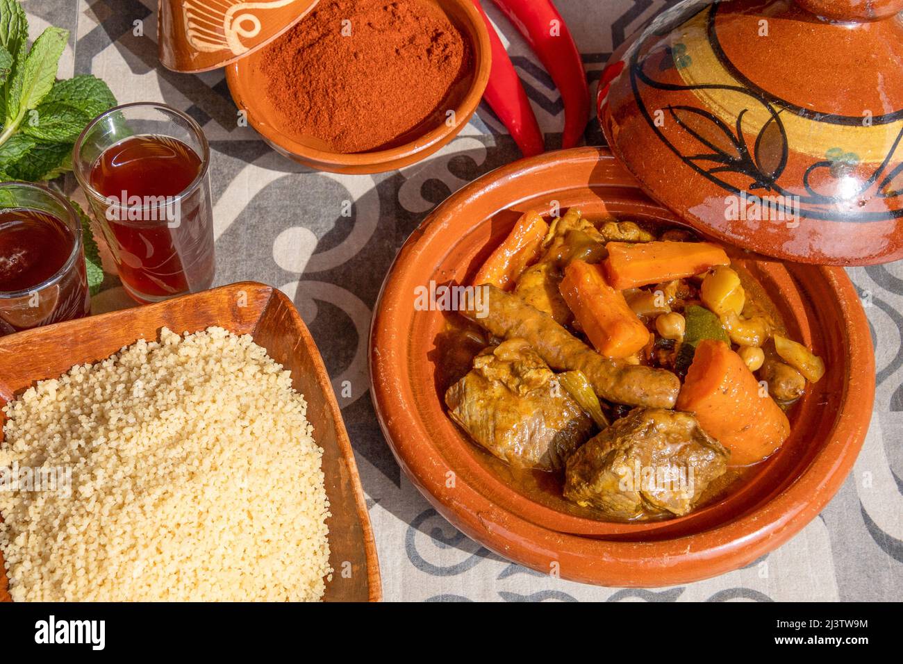 royal couscous with semolina spices and tea on a table Stock Photo - Alamy
