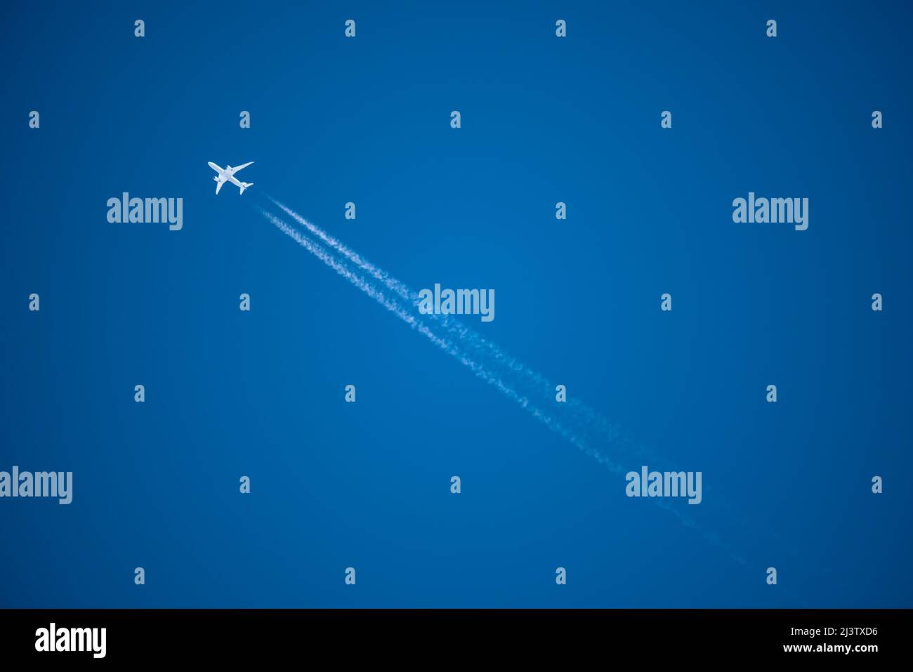 An Easyjet Airbus A320 twin engine jet airliner in deep blue sky with ...