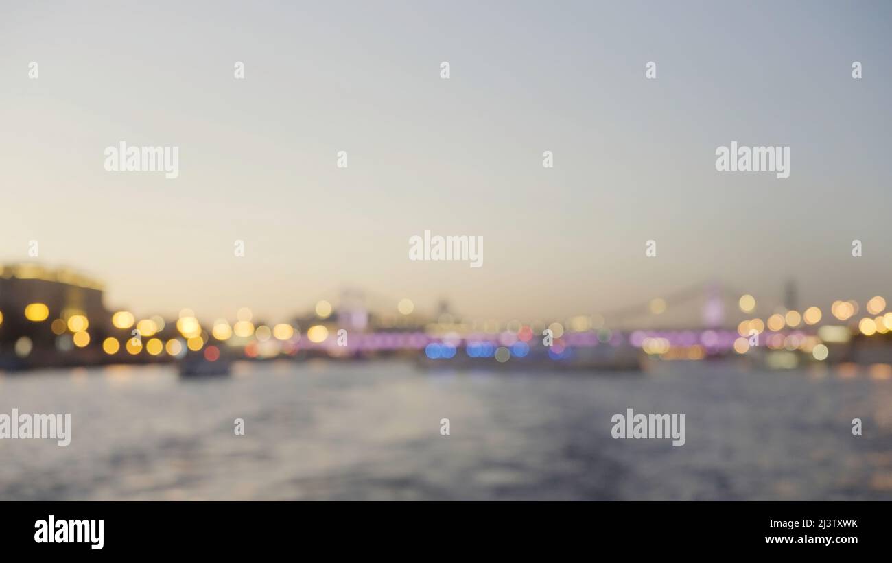 Blurred beautiful sunset landscape with bridge and lights. Action ...