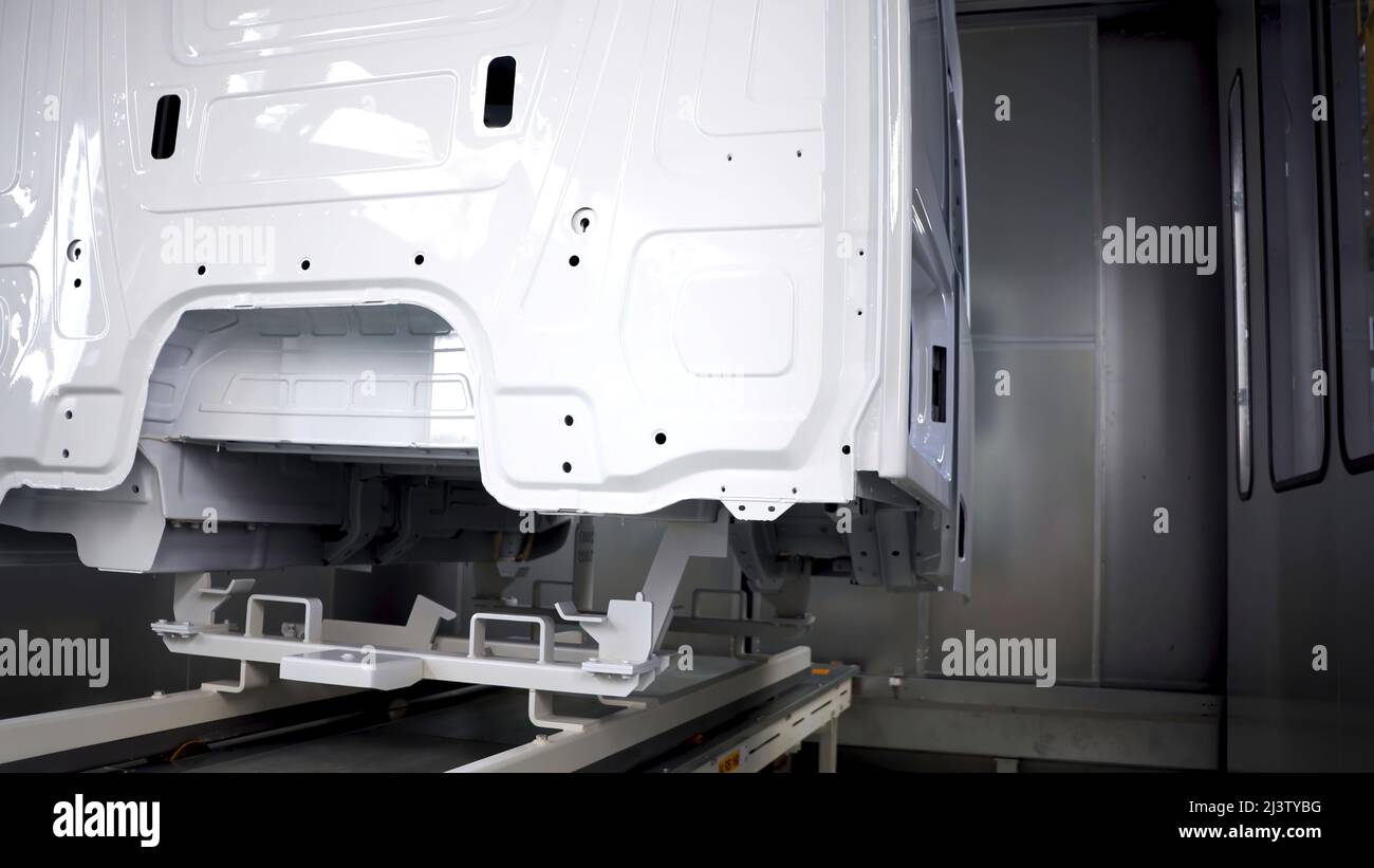 Creating parts and housings for cars at factory. Scene. Process of ...