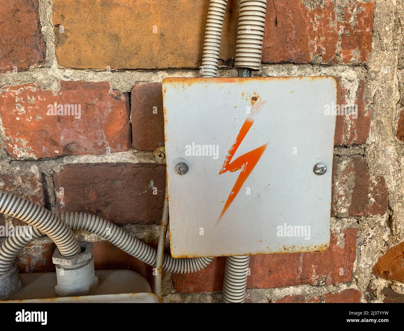 Electricity caution sign. Old red sign Stock Photo - Alamy