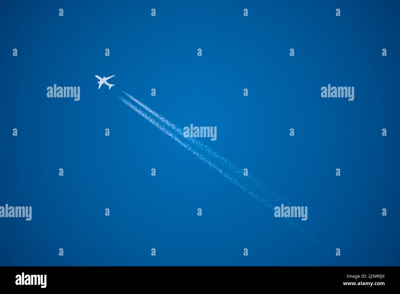 An Easyjet Airbus A320 twin engine jet airliner in deep blue sky with ...