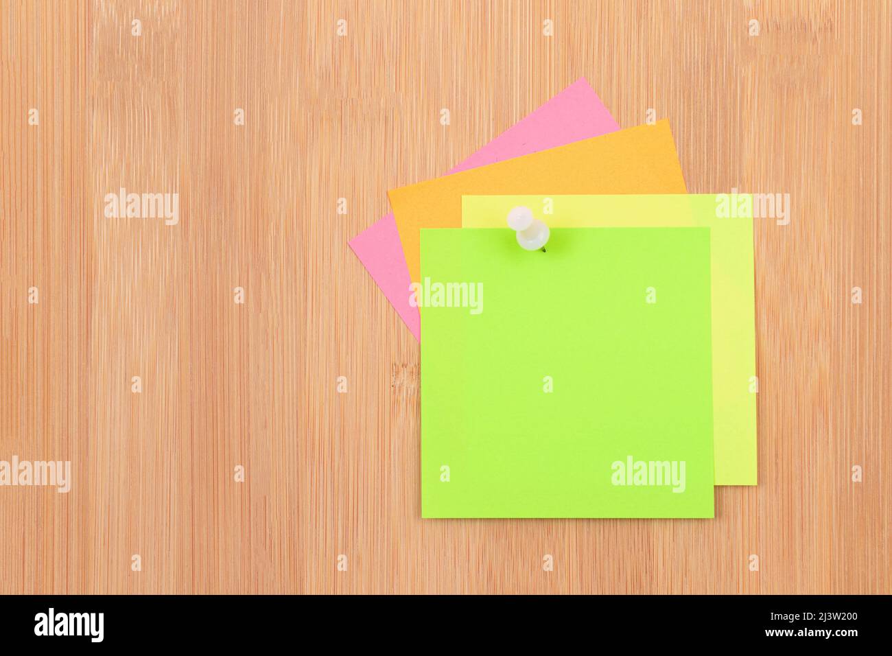 Colored Sticky Notes with Copyspace Pinned to the Wooden Message Board ...
