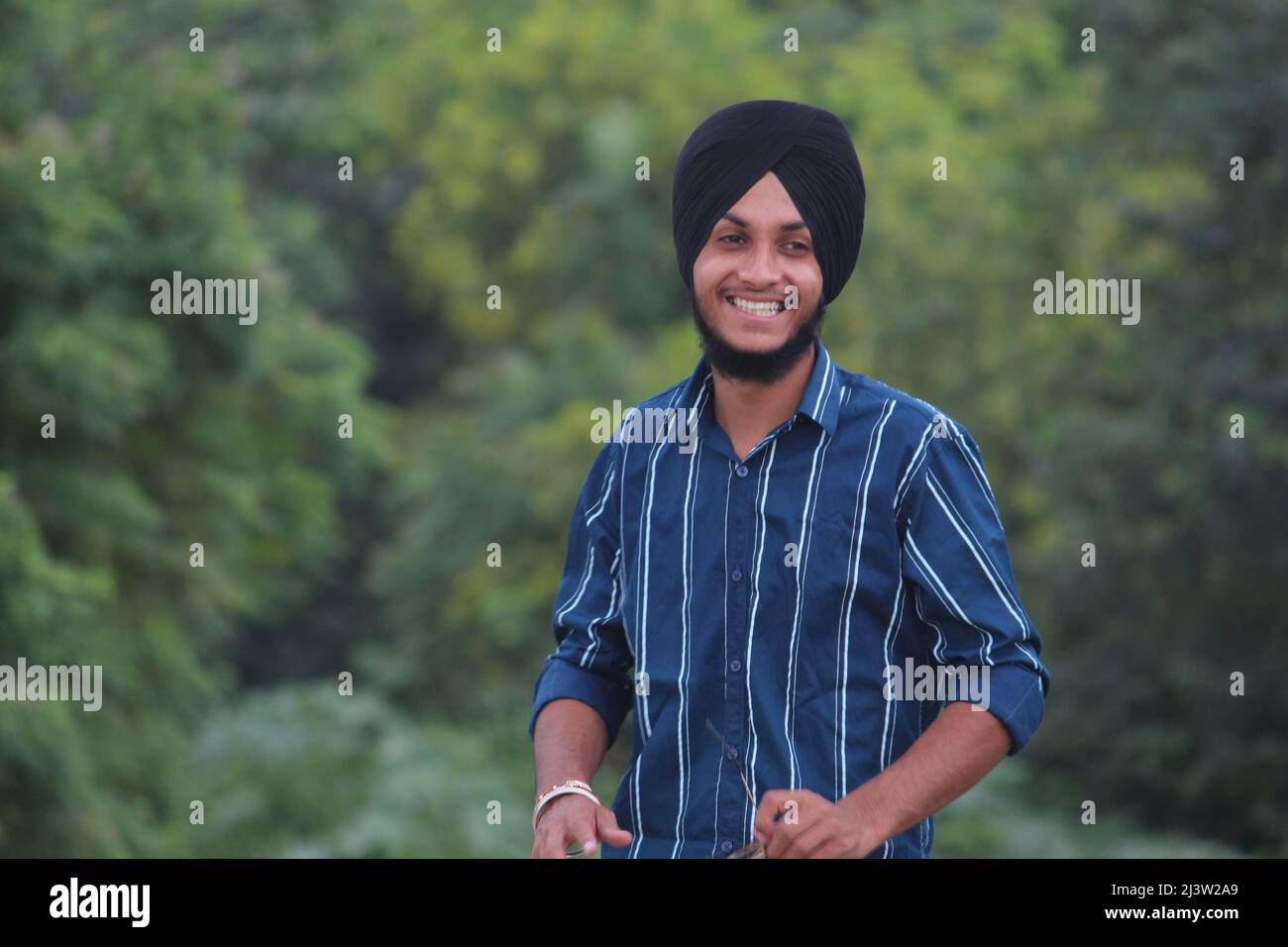 portrait of Young happy Indian sikh handsome man with smile, Mumbai ...