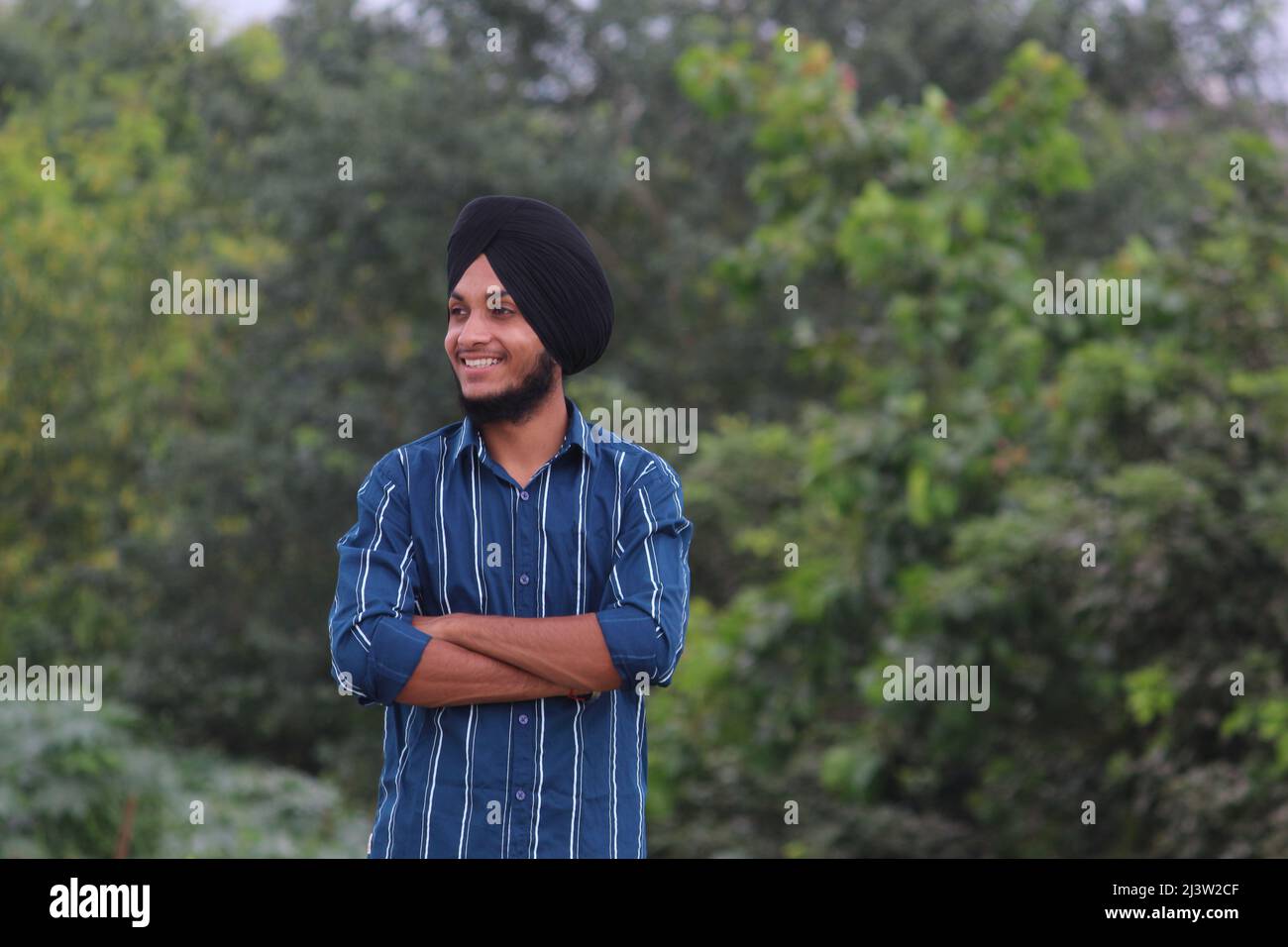portrait of Young happy Indian sikh handsome man with smile, Mumbai ...