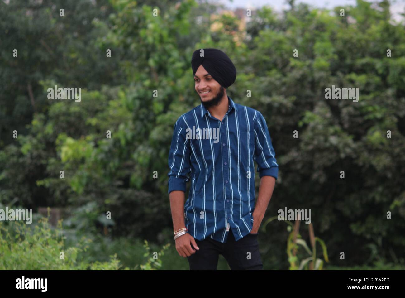portrait of Young happy Indian sikh handsome man with smile, Mumbai ...