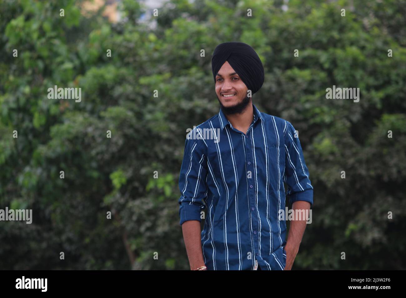 portrait of Young happy Indian sikh handsome man with smile, Mumbai ...