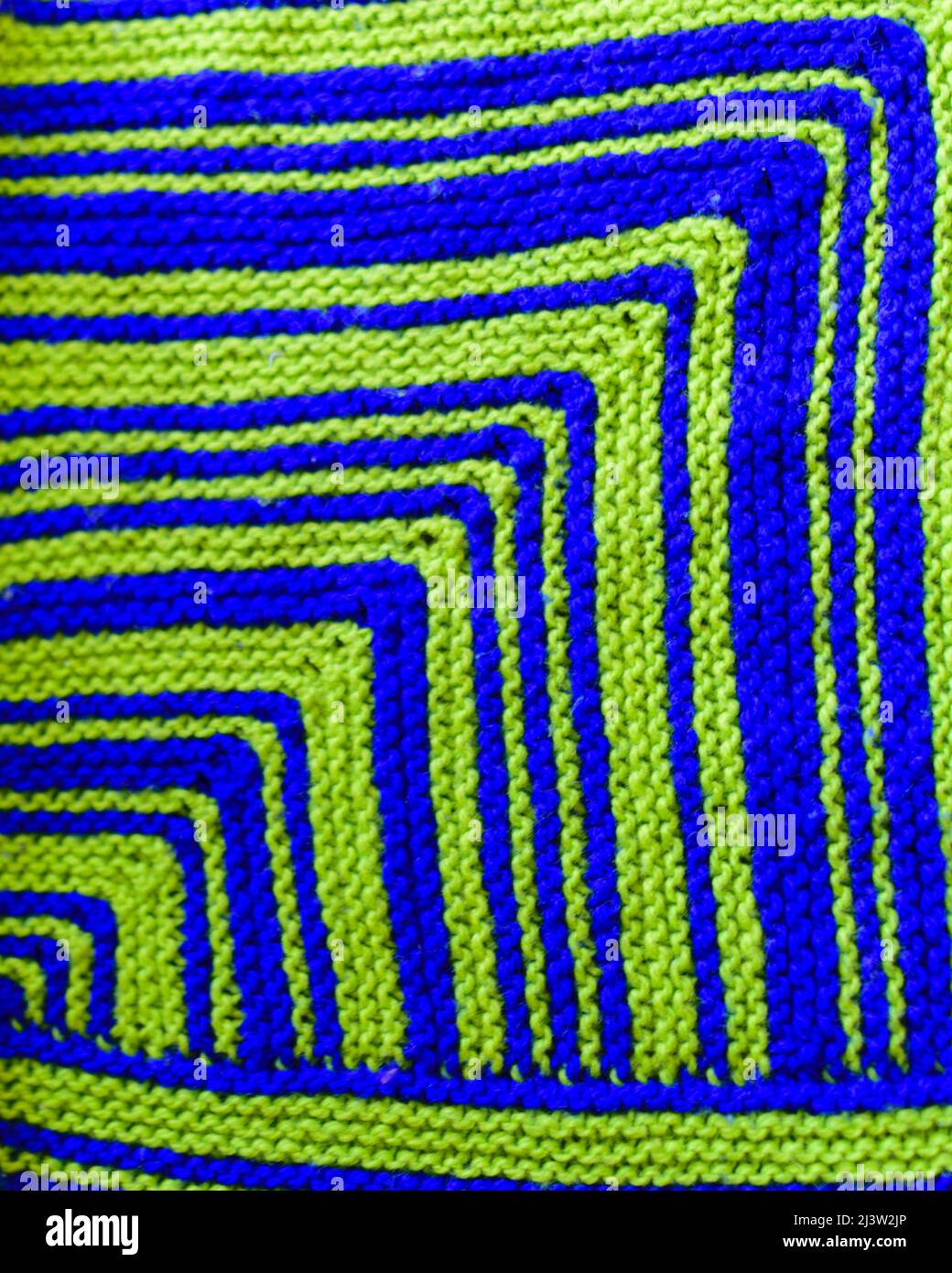 Close-up background image of a patchwork quilt with a colorful graphic ...
