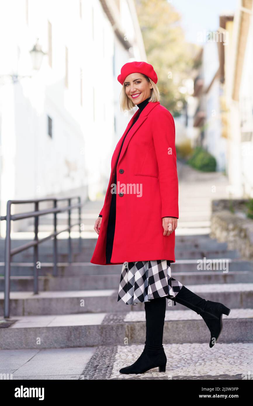 Stylish woman walking on steps Stock Photo - Alamy