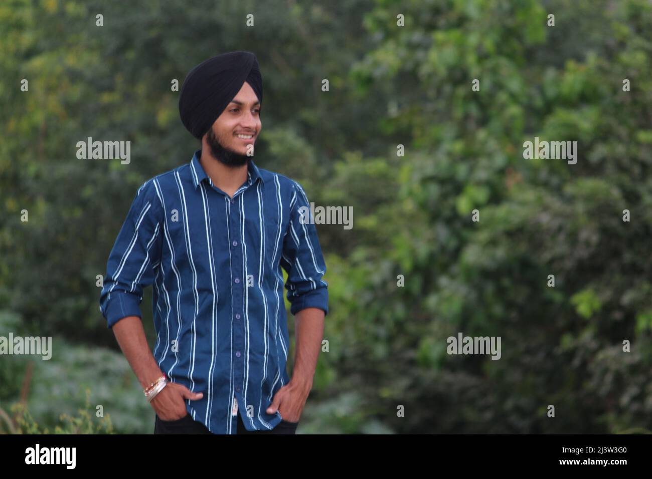 portrait of Young happy Indian sikh handsome man with smile, Mumbai ...