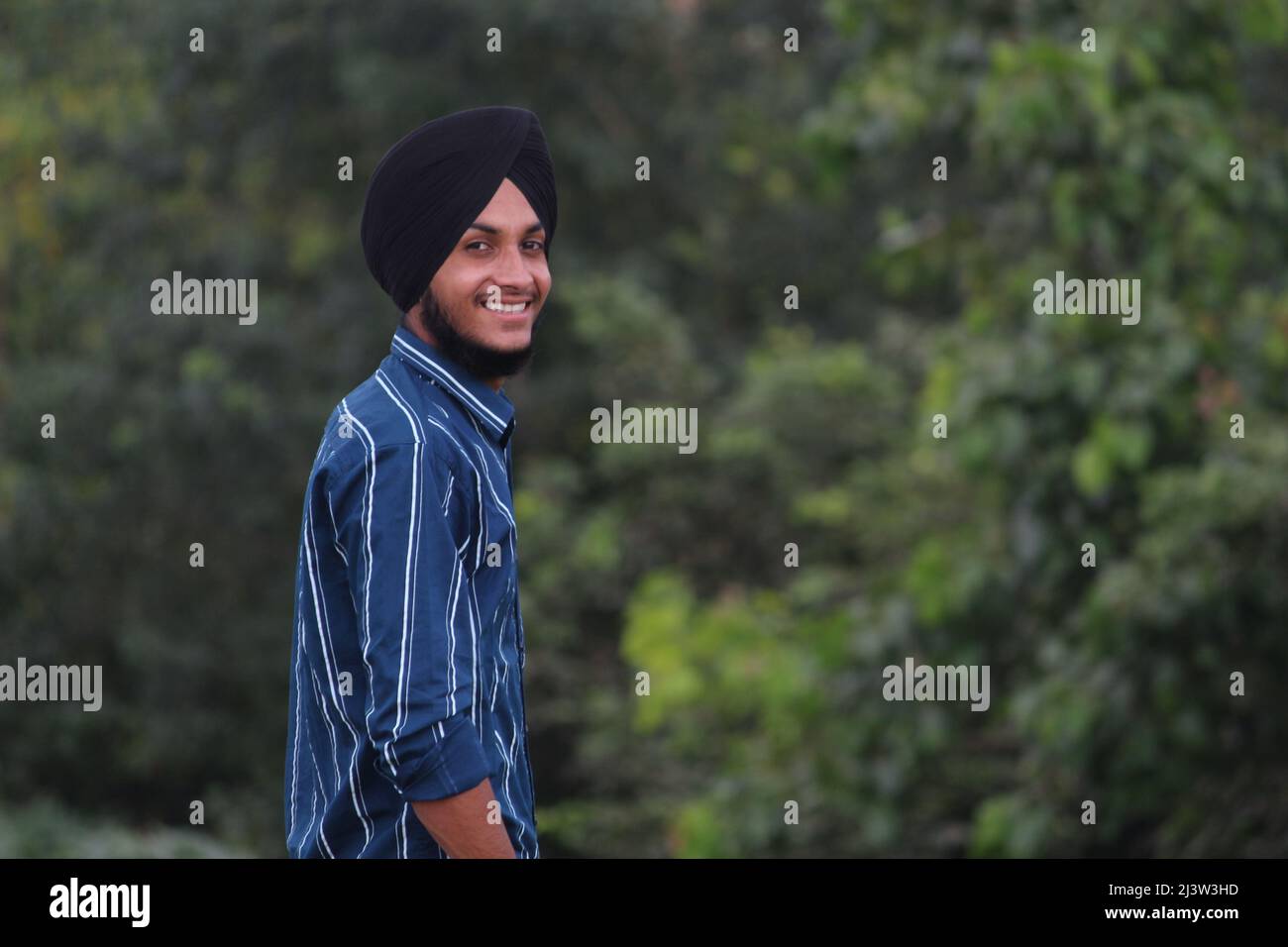 portrait of Young happy Indian sikh handsome man with smile, Mumbai ...