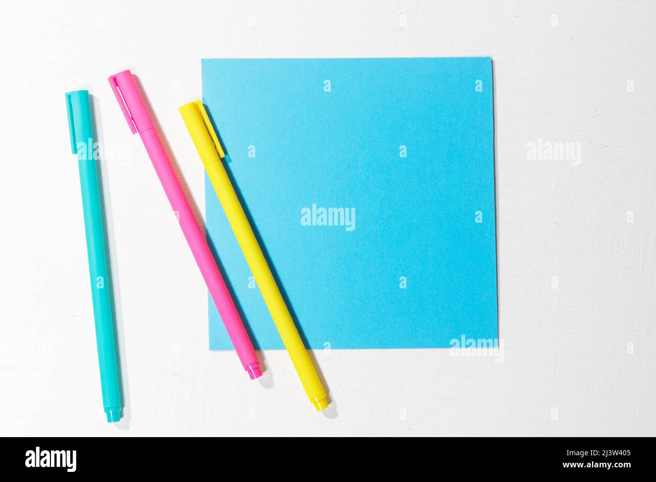 Multi-colored paper blue square on a white background, three multi ...