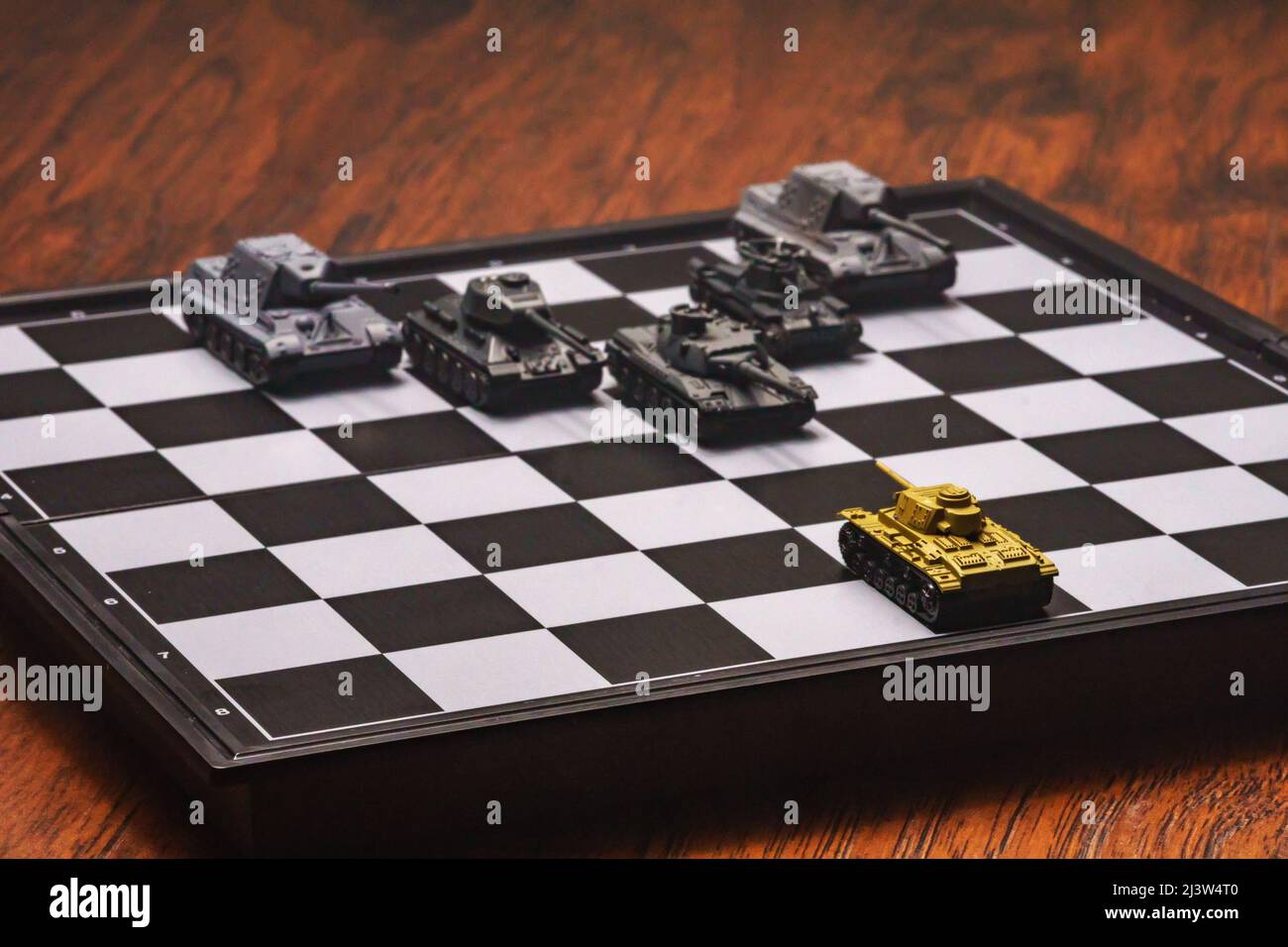 Toy tanks on a chessboard. The concept of military strategy Stock Photo ...