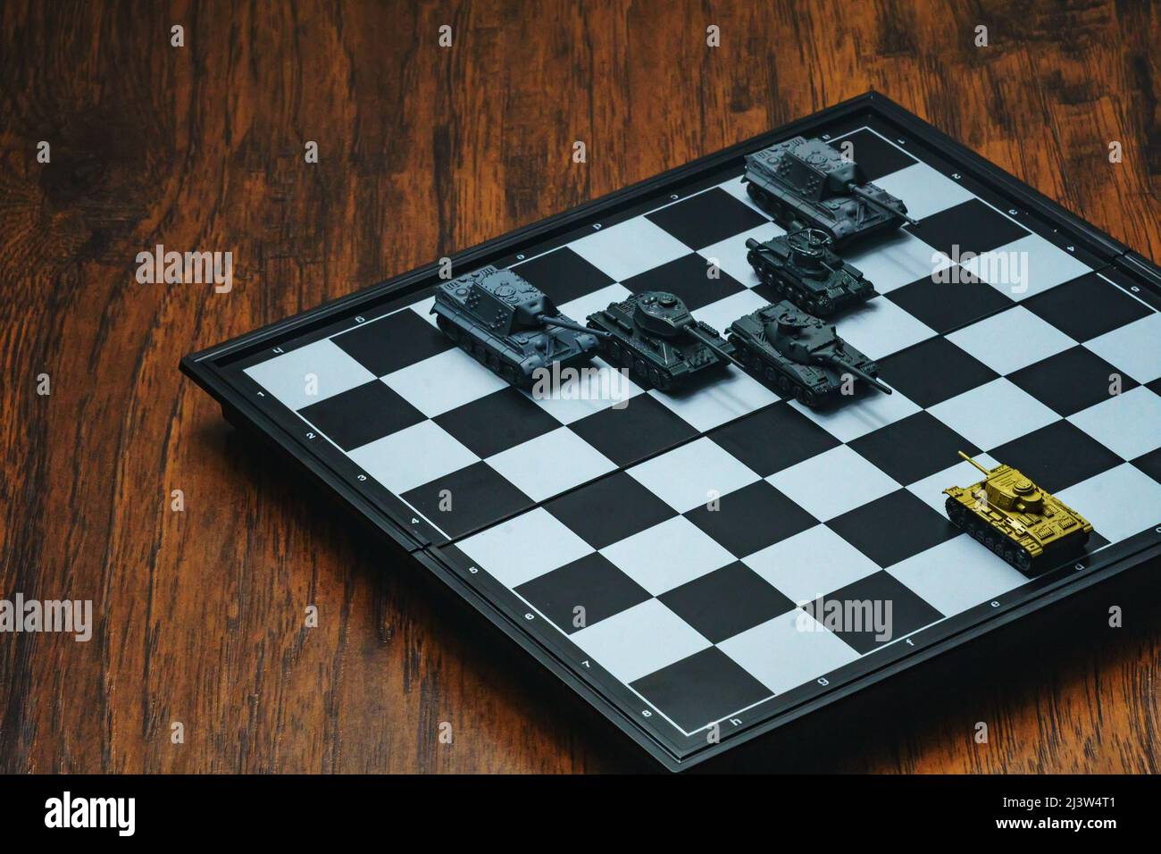 Toy tanks on a chessboard. The concept of military strategy Stock Photo ...