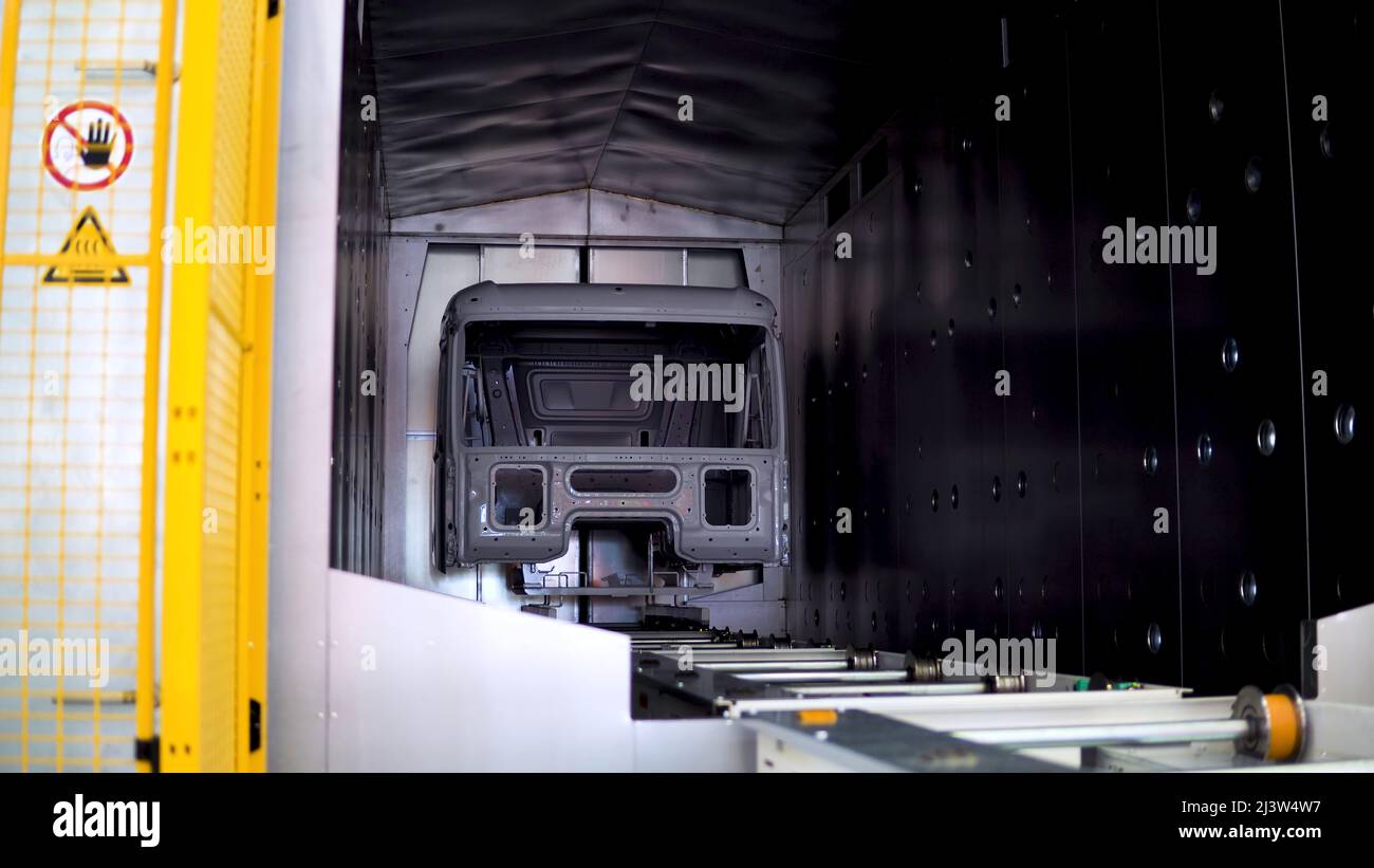 Creating parts and housings for cars at factory. Scene. Process of ...