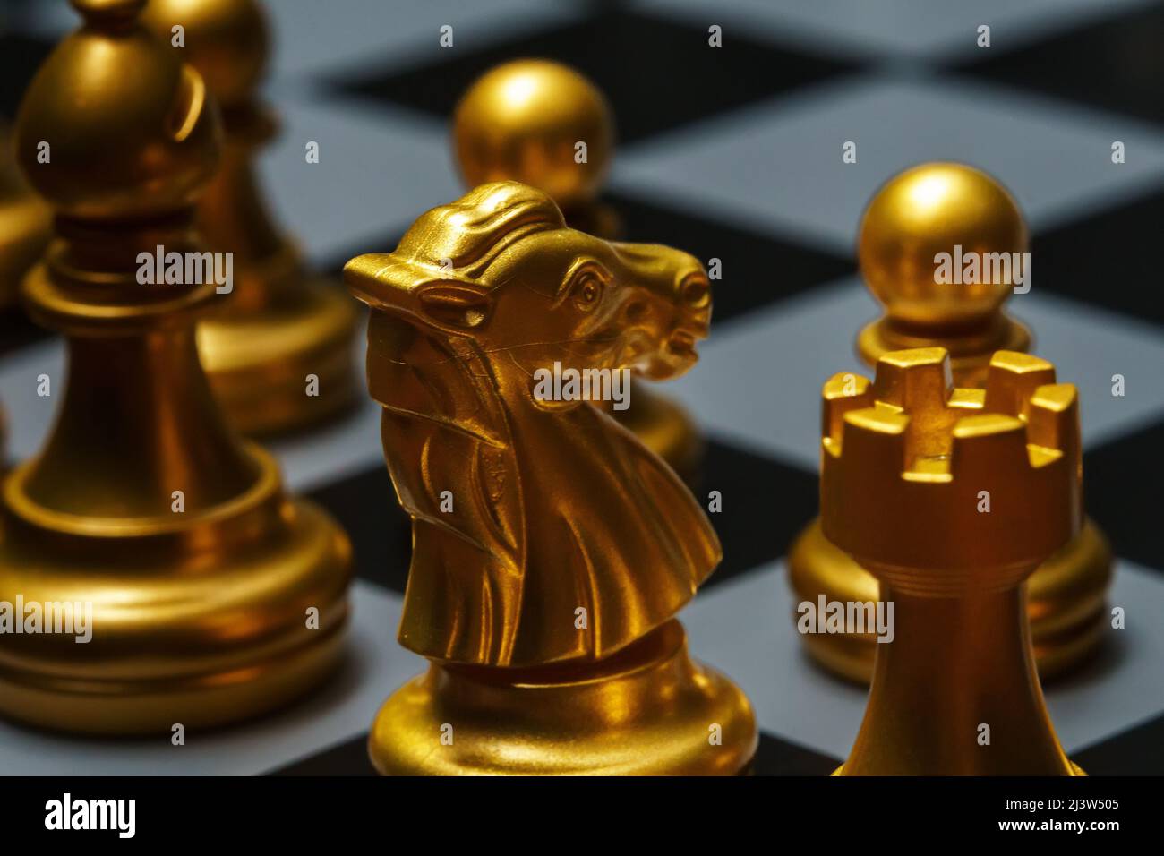 Chess board game. The figure of a knight on the board Stock Photo - Alamy