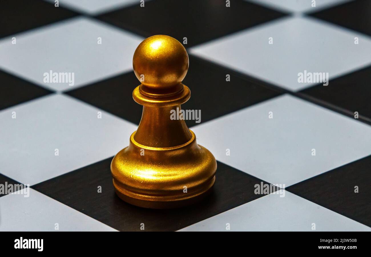 Chess board game. Pawn figure on the board Stock Photo - Alamy