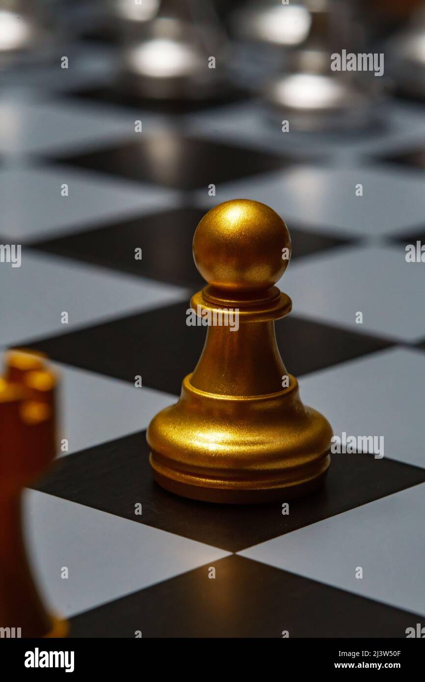 Chess board game. Pawn figure on the board Stock Photo - Alamy