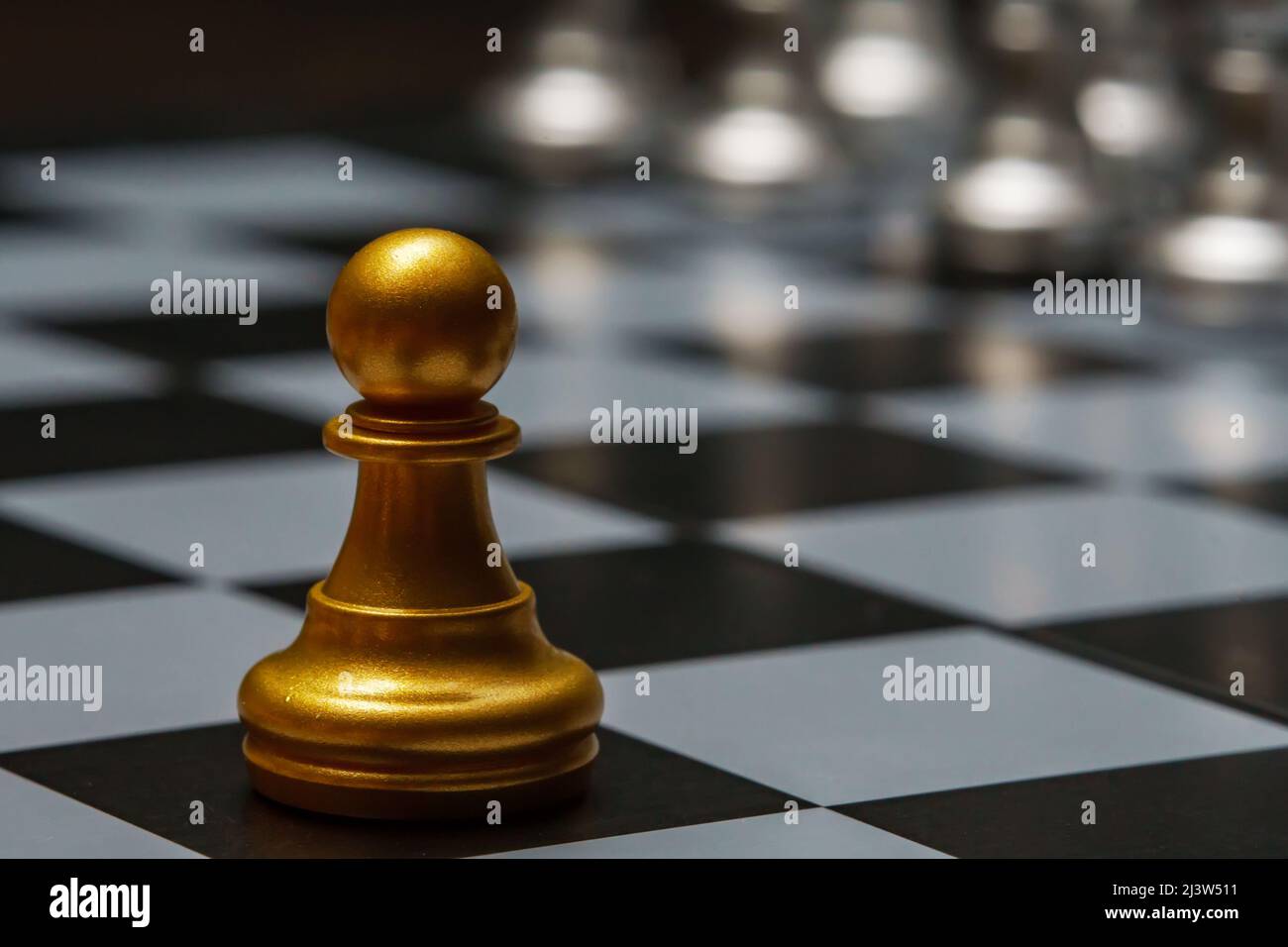 Chess board game. Pawn figure on the board Stock Photo - Alamy