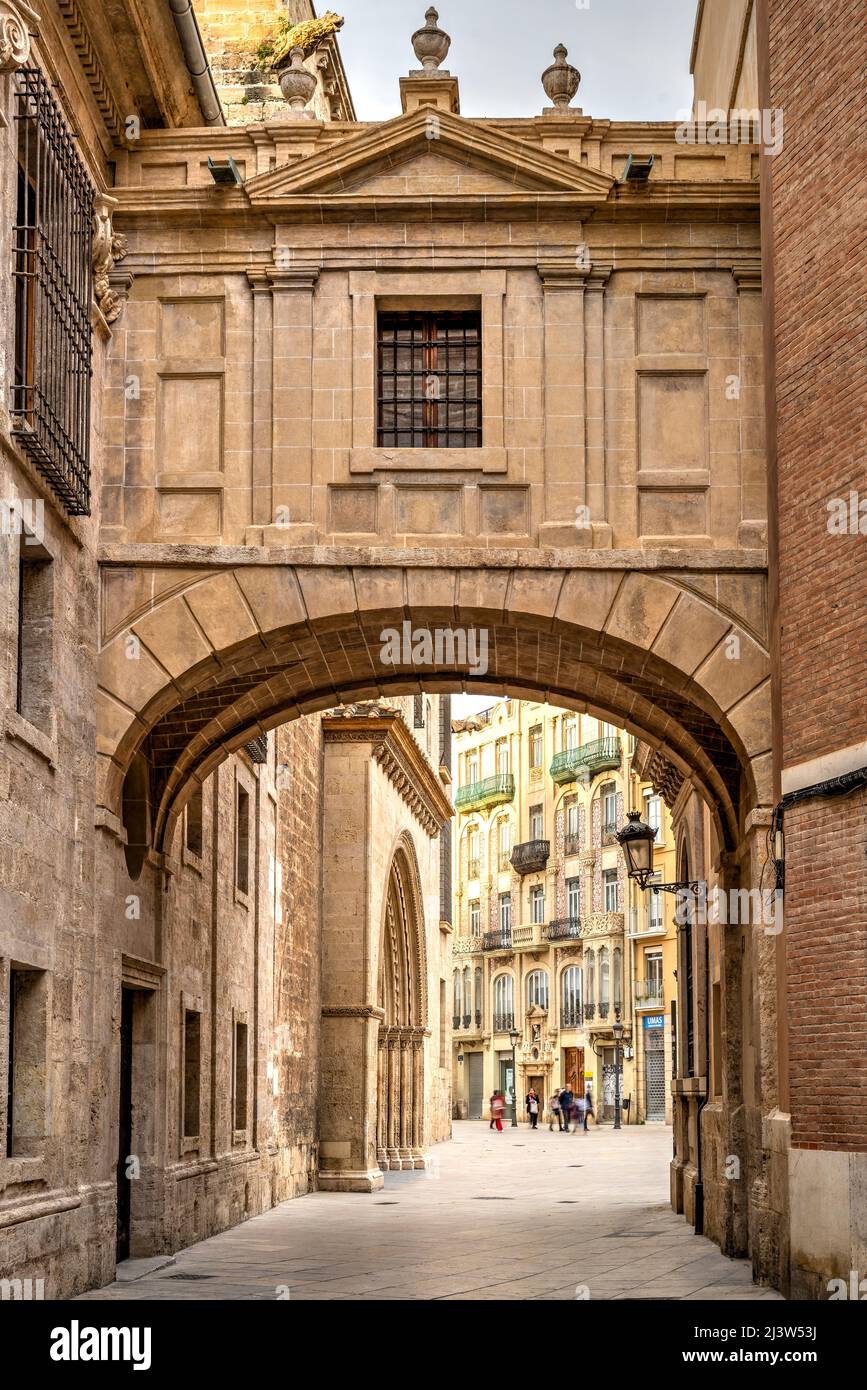 Scenic street with arch bridge in the old town, Valencia, Valencian ...