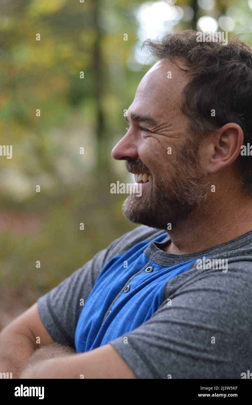 a smiling man standing outdoors in fall Stock Photo - Alamy