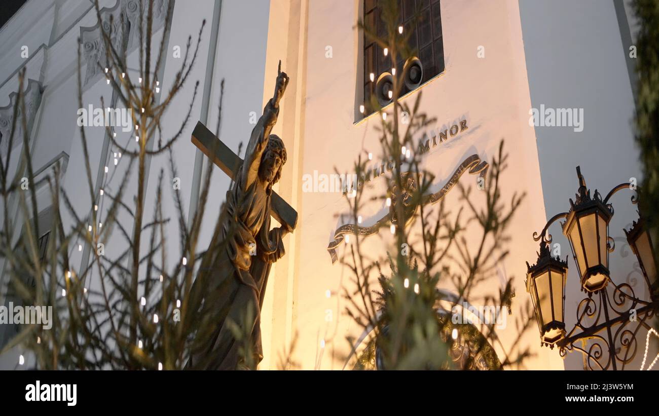 A beautiful small monument with burning garlands around. Action. A ...