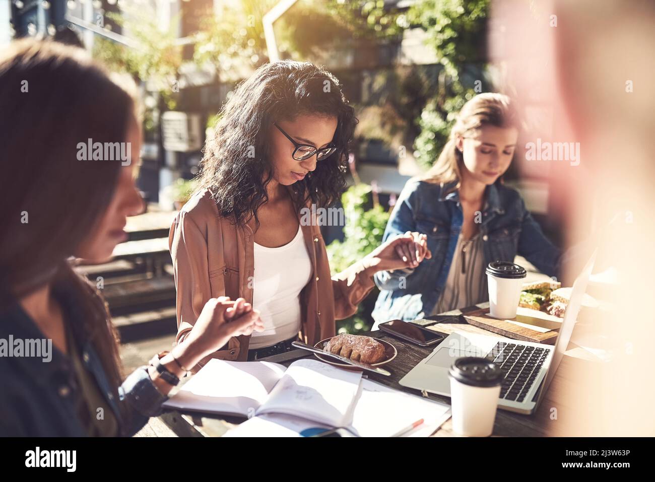 Before we can eat we must pray. Shot of creative employees holding ...