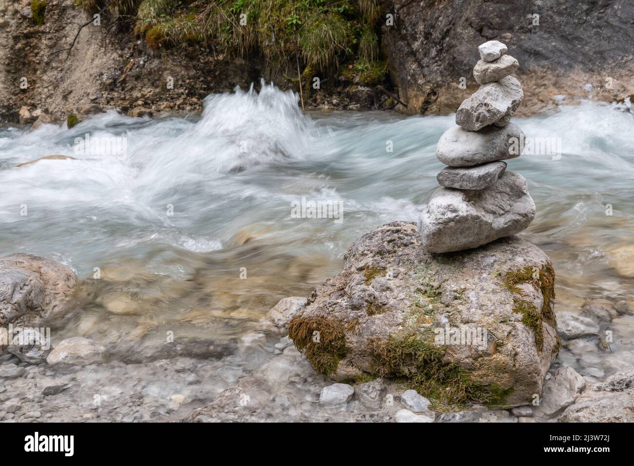 stone tower on a rock by the torrent Stock Photo - Alamy