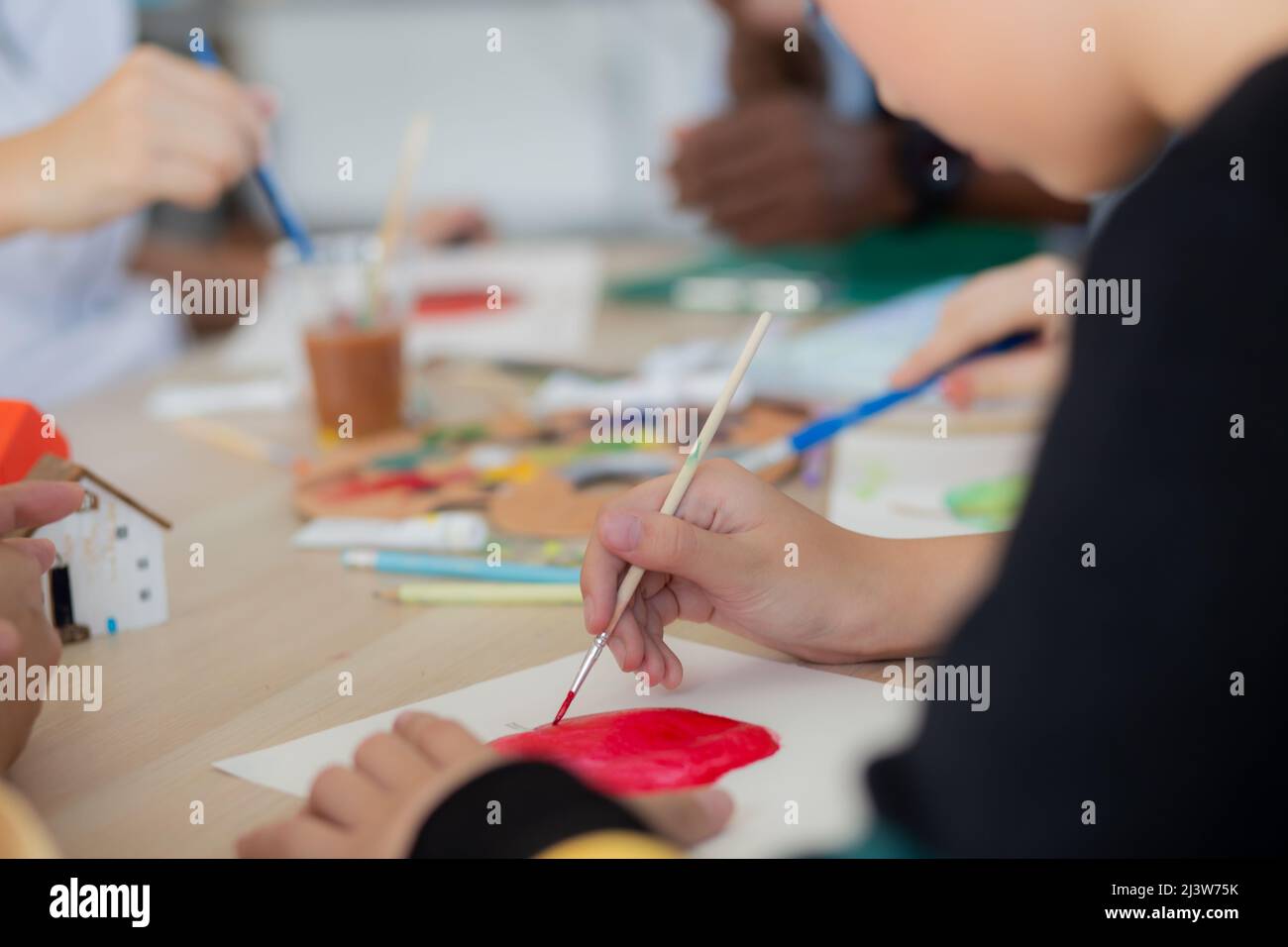 Closeup group of student sitting and studying and learning drawing with ...