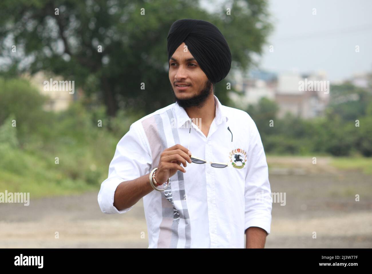 portrait of Young happy Indian sikh handsome man with smile, Mumbai ...