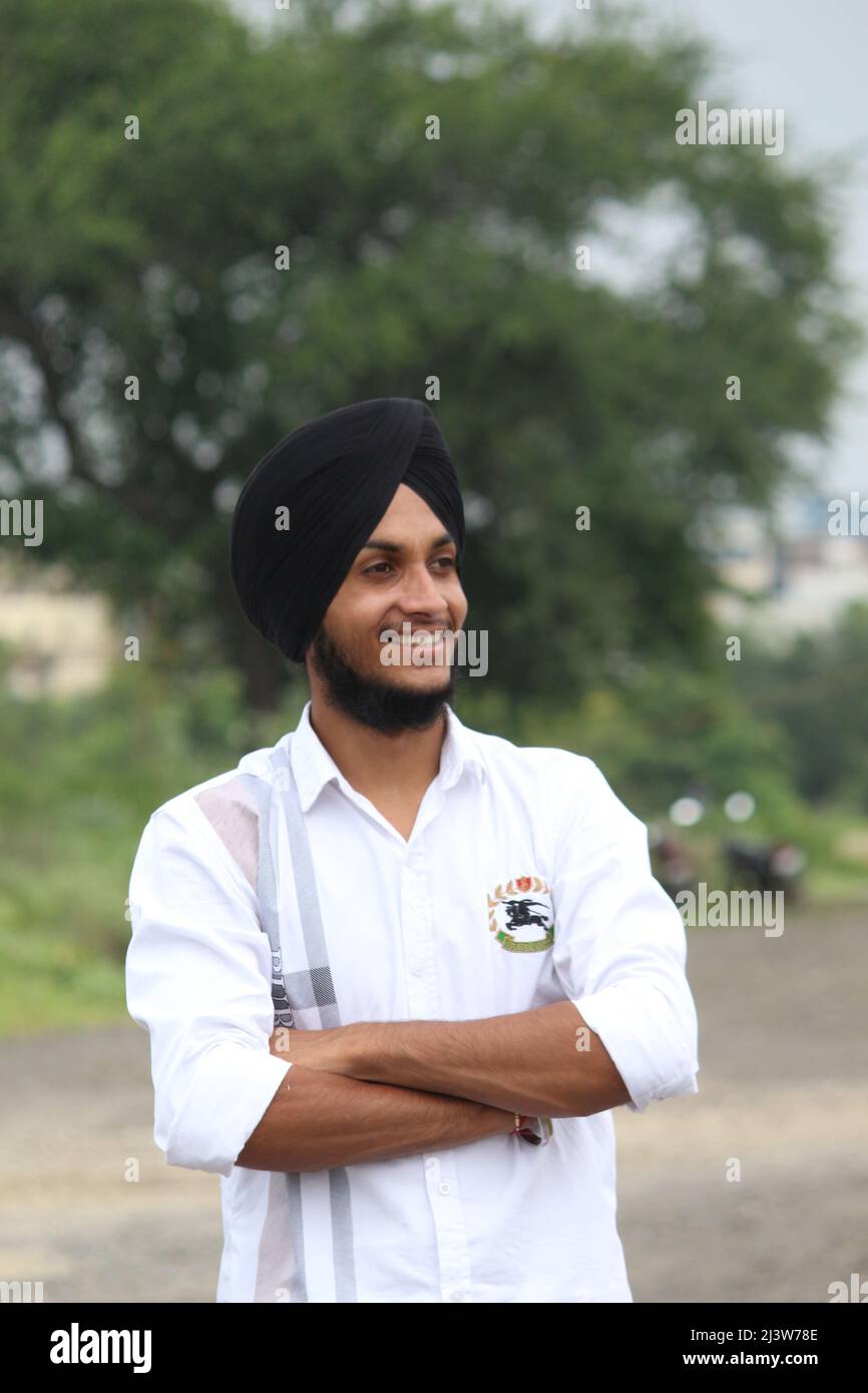portrait of Young happy Indian sikh handsome man with smile, Mumbai ...