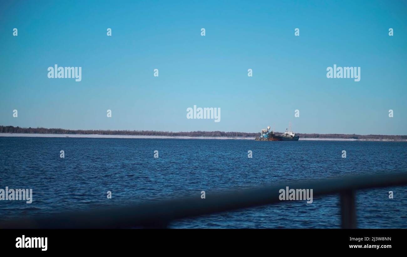 A snowy sea with ships.Clip. Huge ships with cargo move through the ...