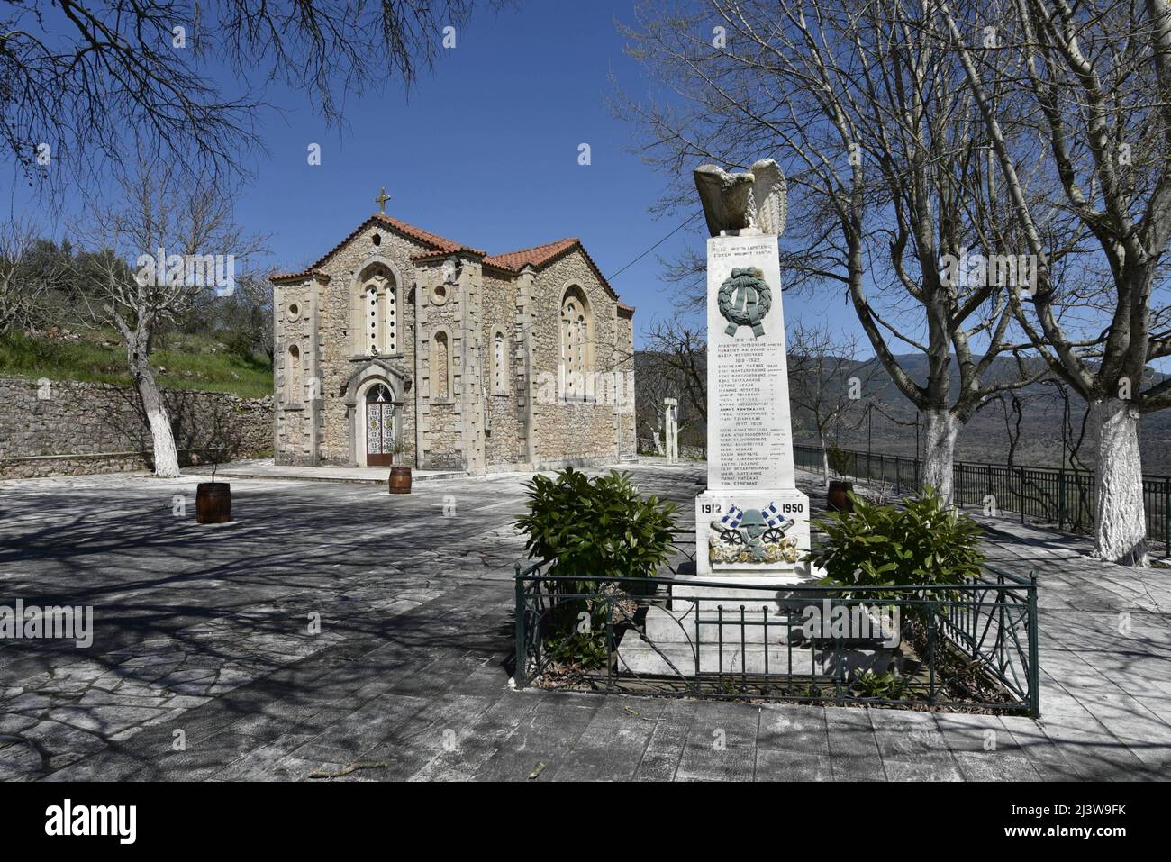 Landscape with scenic view of Aghios Athanassios a historic stone built church and monument ...