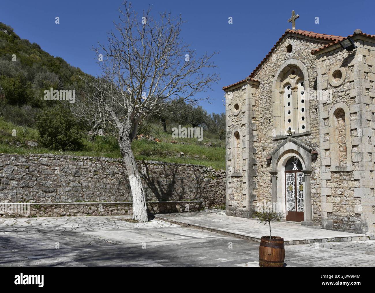 Landscape with scenic view of Aghios Athanassios a historic stone built ...