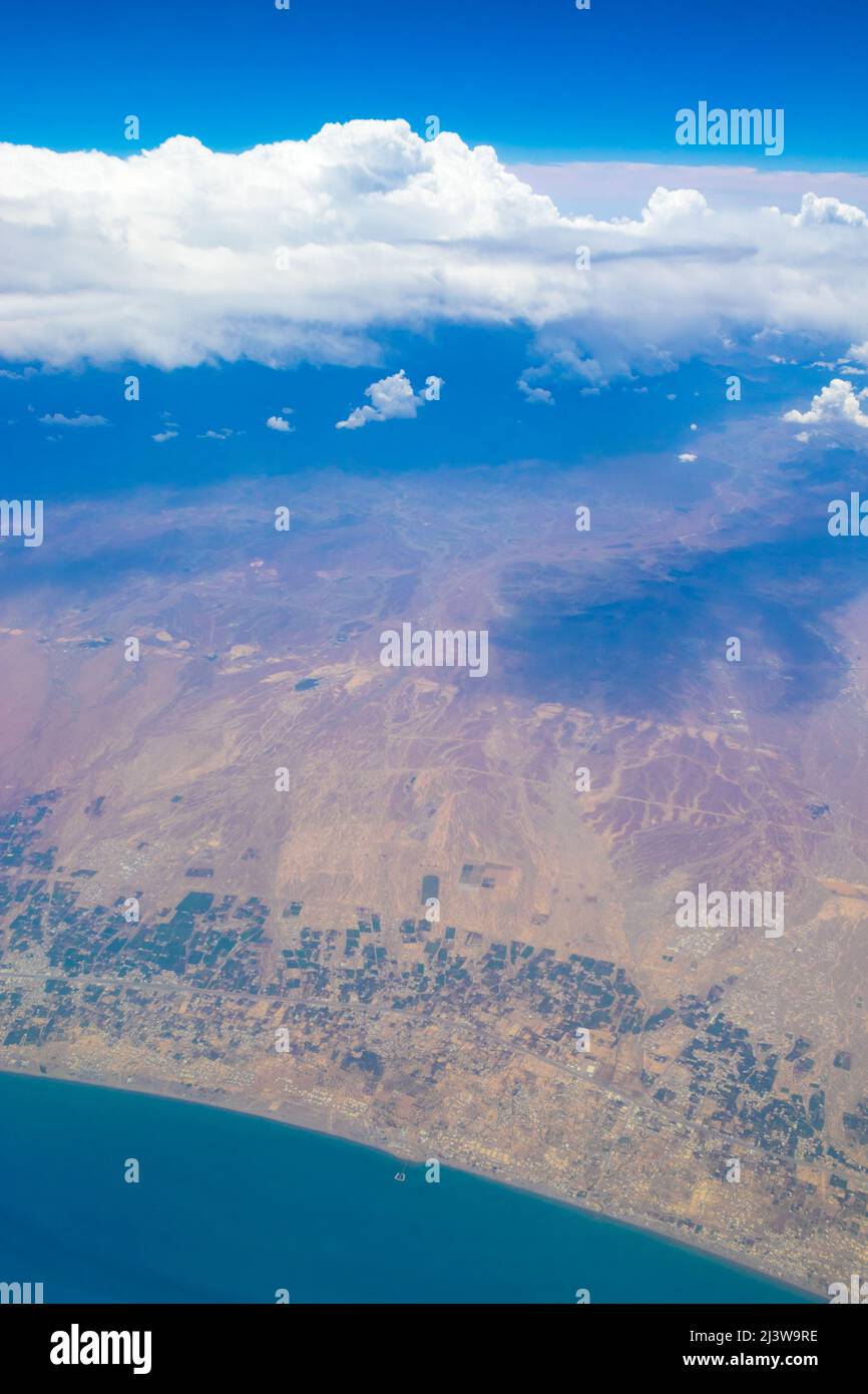 Aerial view of the coastline at the Gulf of Oman and Hajar Mountains ...