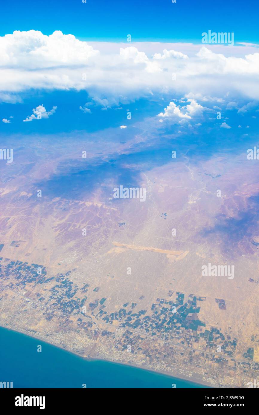 Aerial view of the coastline at the Gulf of Oman and Hajar Mountains ...