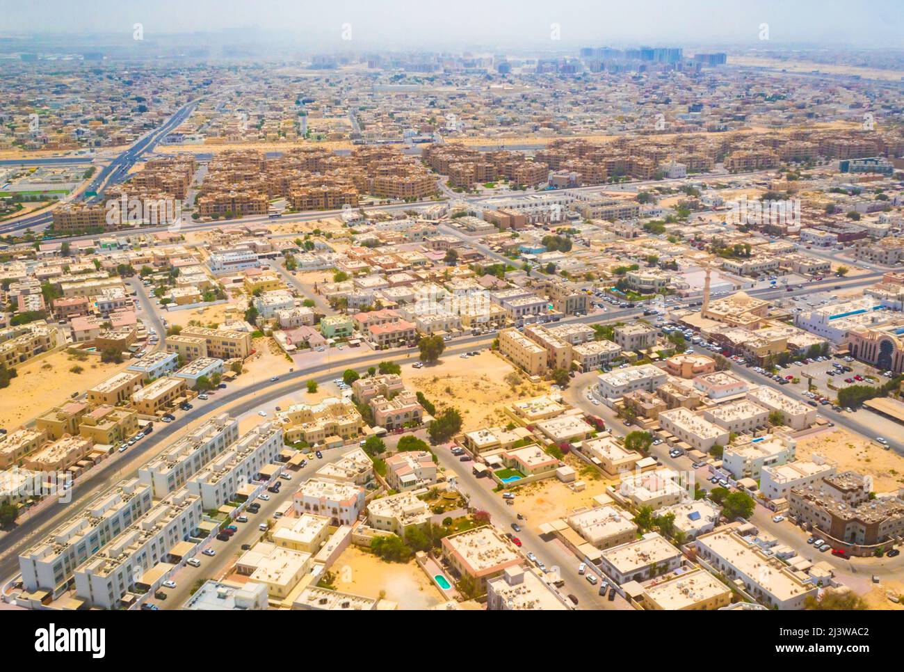 Aerial view of residential district and E311 motorway in Dubai city at ...